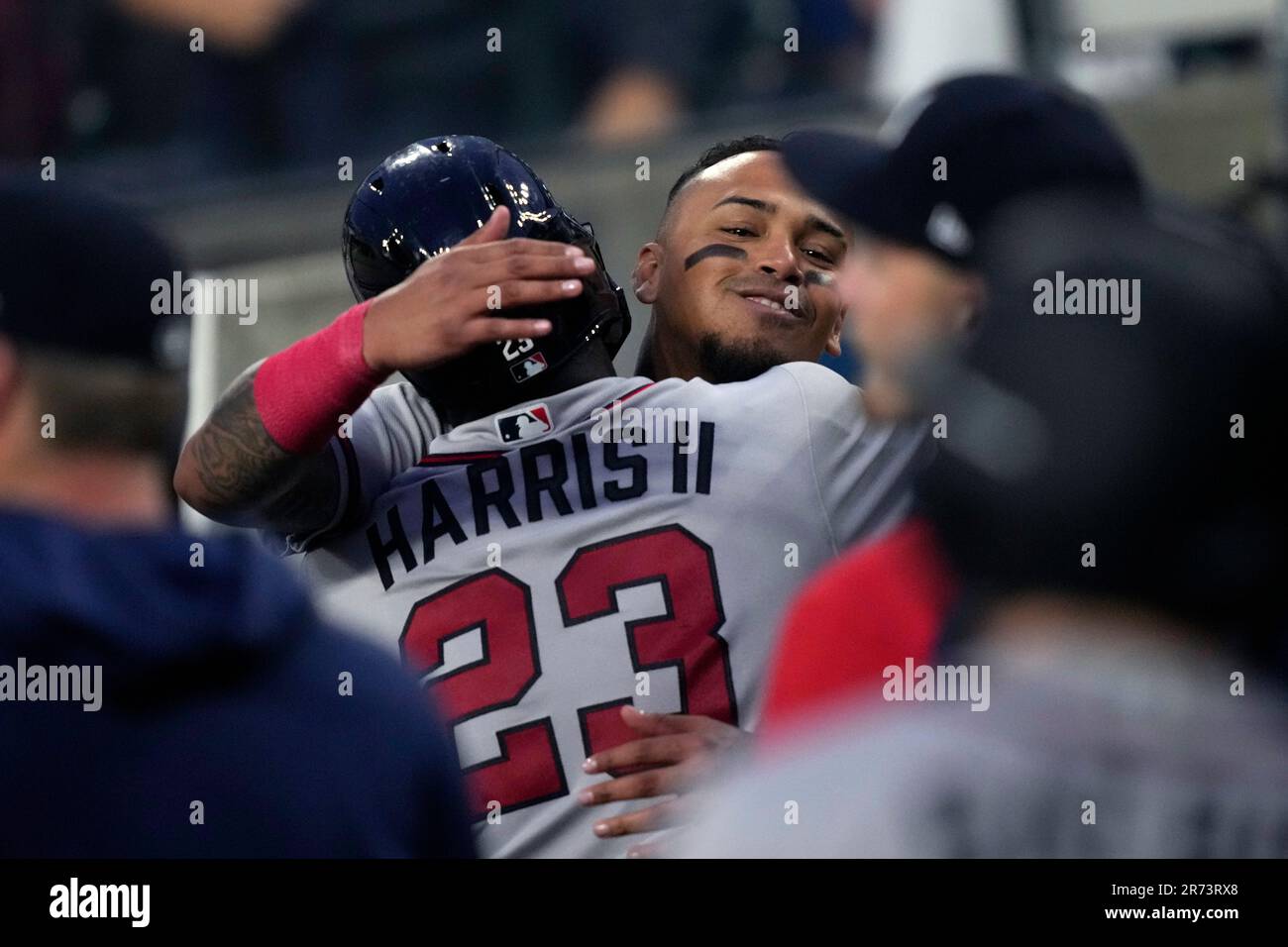 Atlanta Braves' Michael Harris II is hugged by Orlando Arcia in the ...