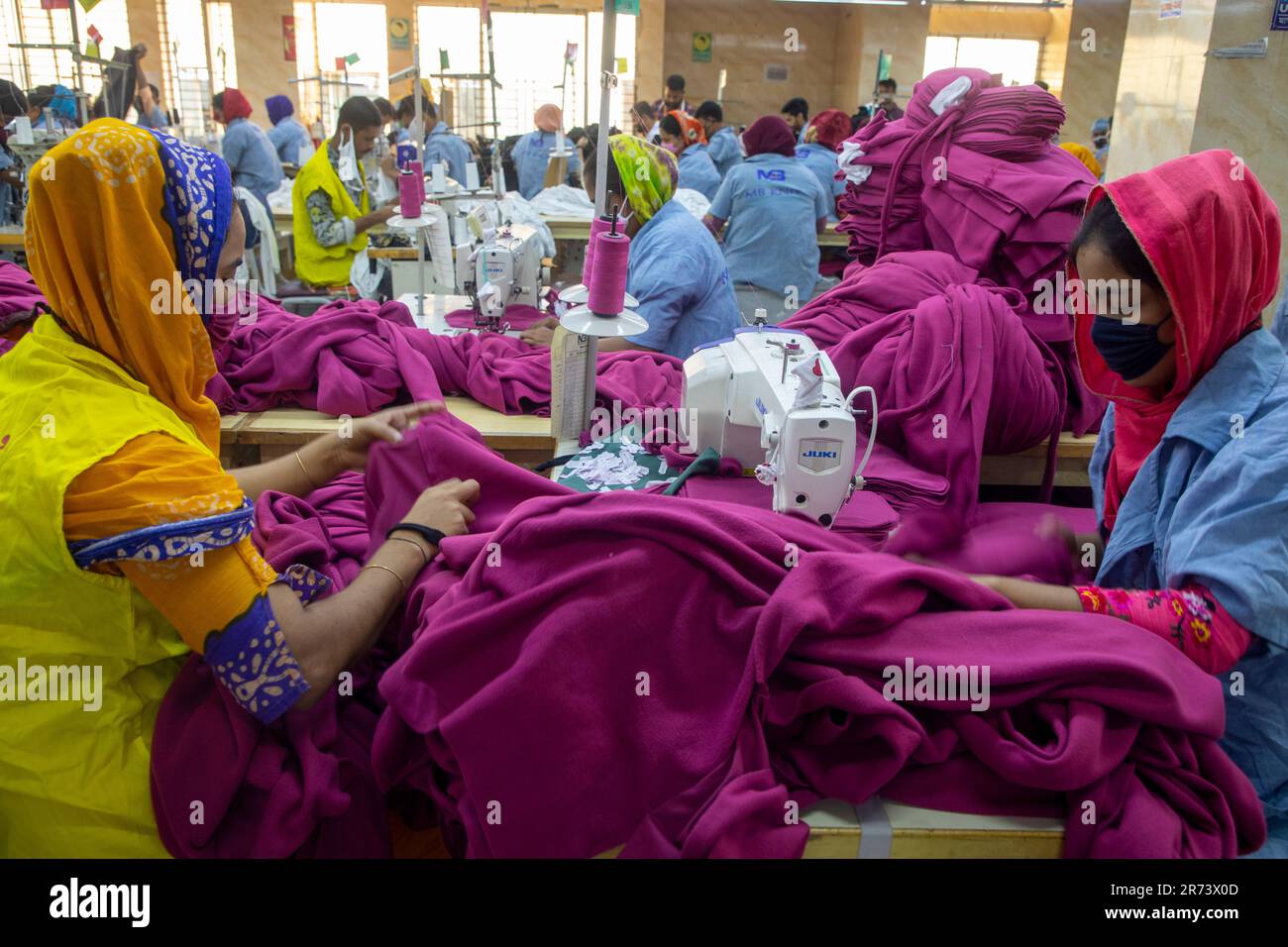 Ready-made garments (RMG) workers working in a factory at Fatullah in ...