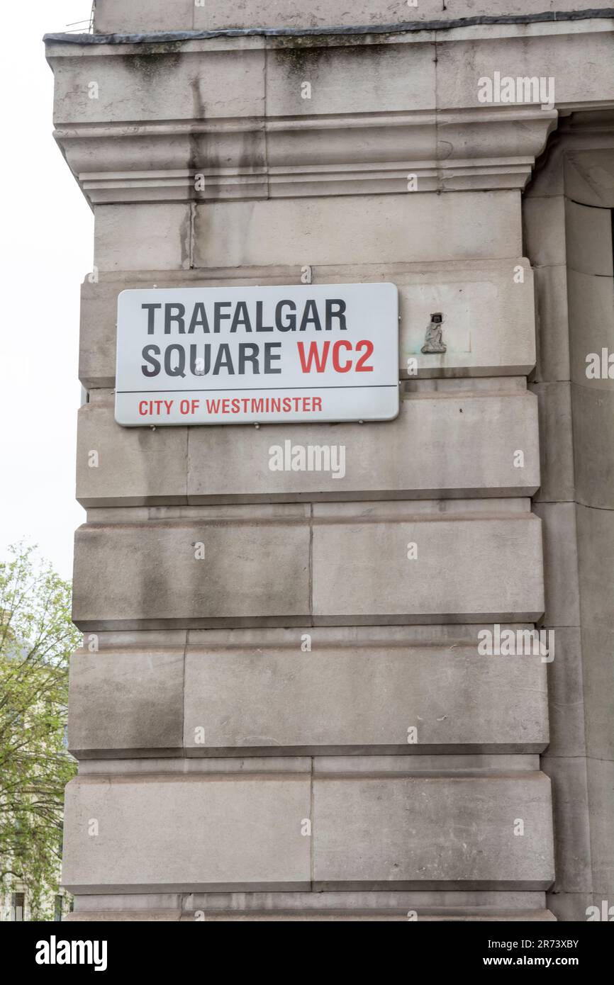 Trafalgar Square street sign on the building wall in the London city ...