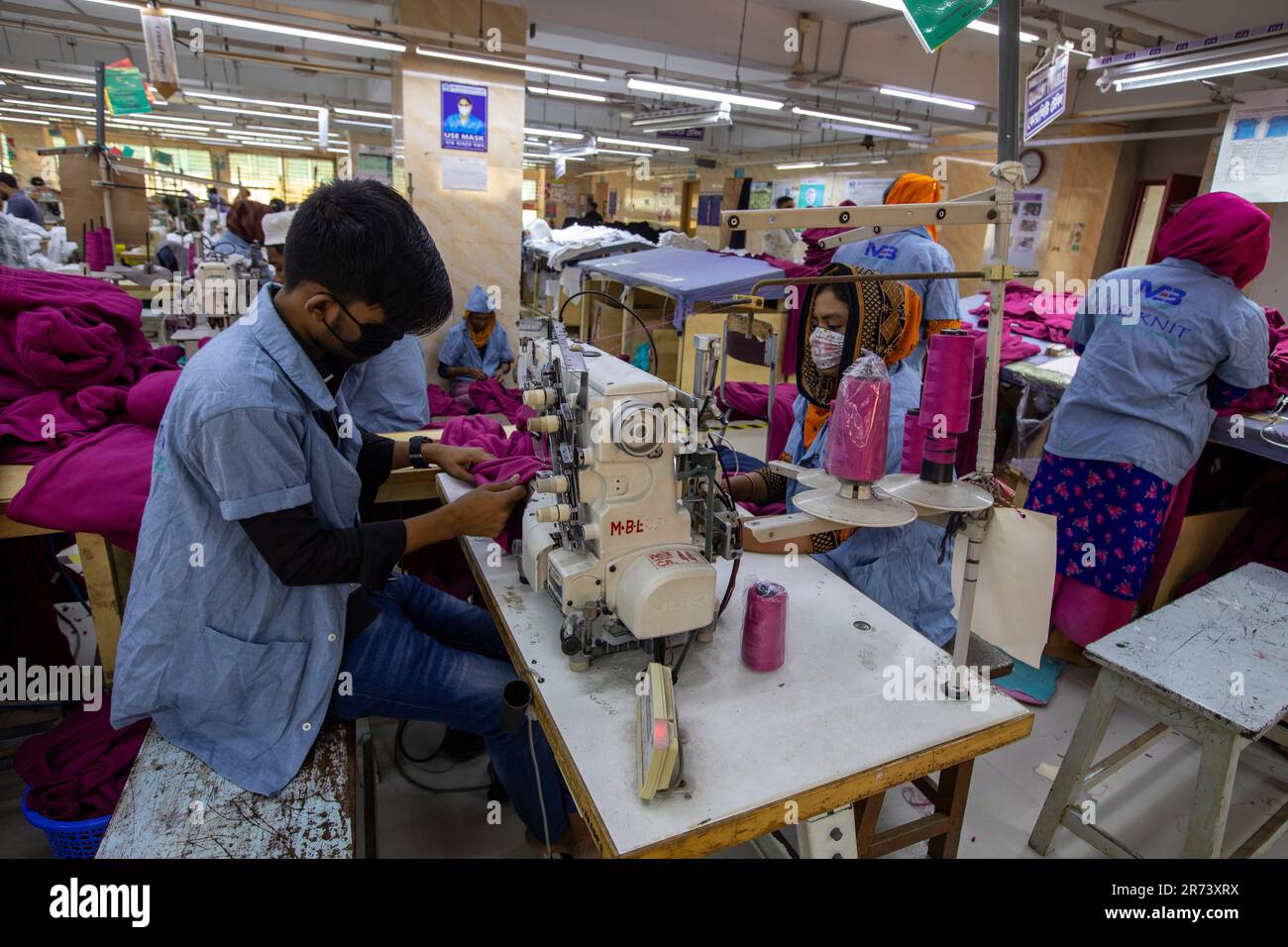 Ready-made garments (RMG) workers working in a factory at Fatullah in ...