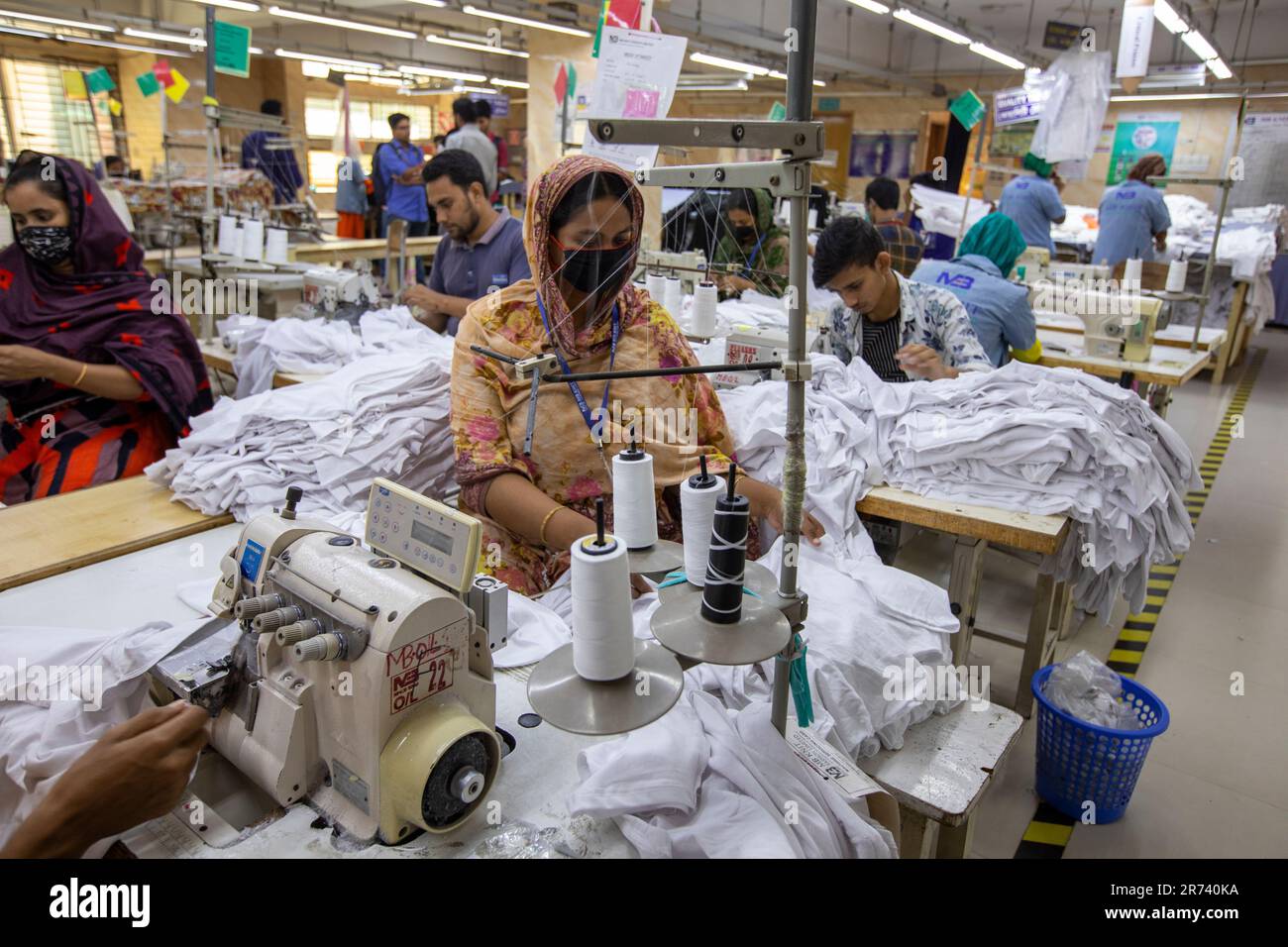 Ready-made garments (RMG) workers working in a factory at Fatullah in ...