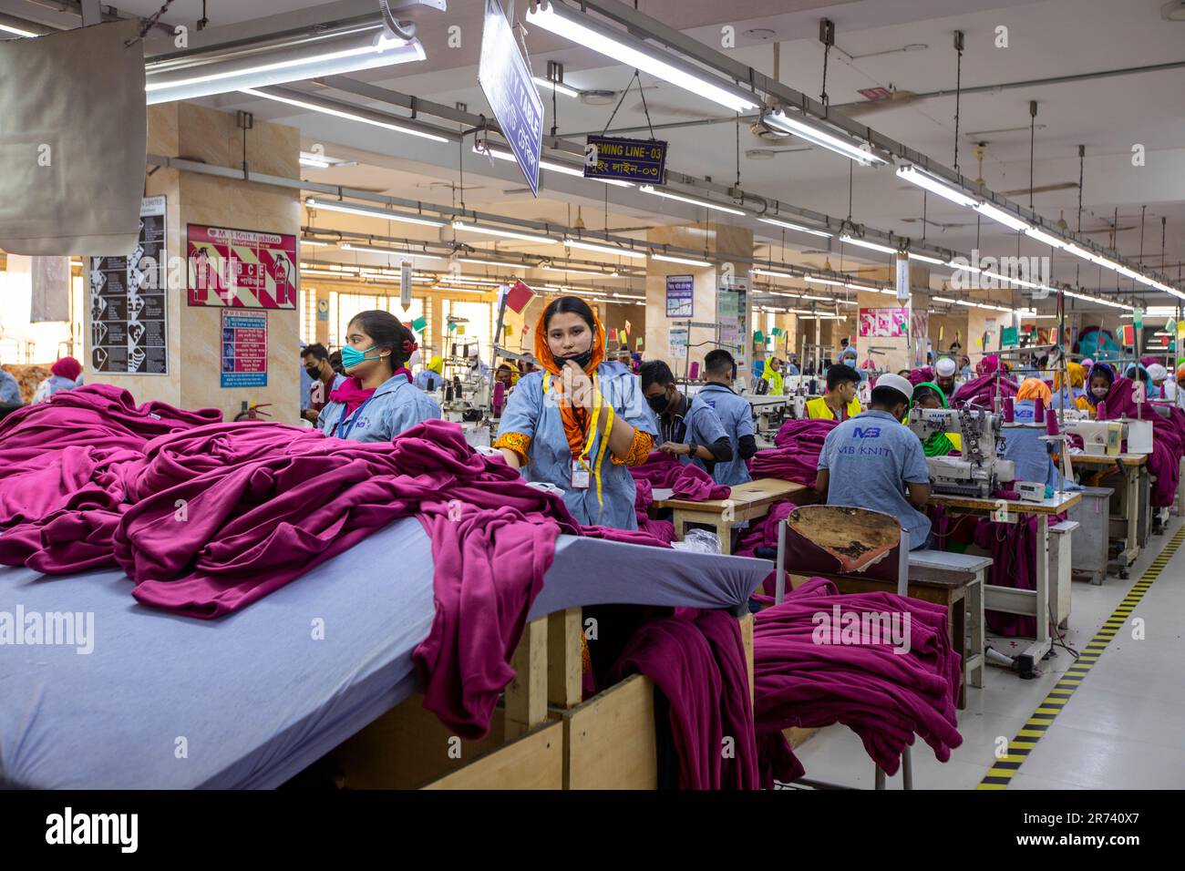 Ready-made garments (RMG) workers working in a factory at Fatullah in ...