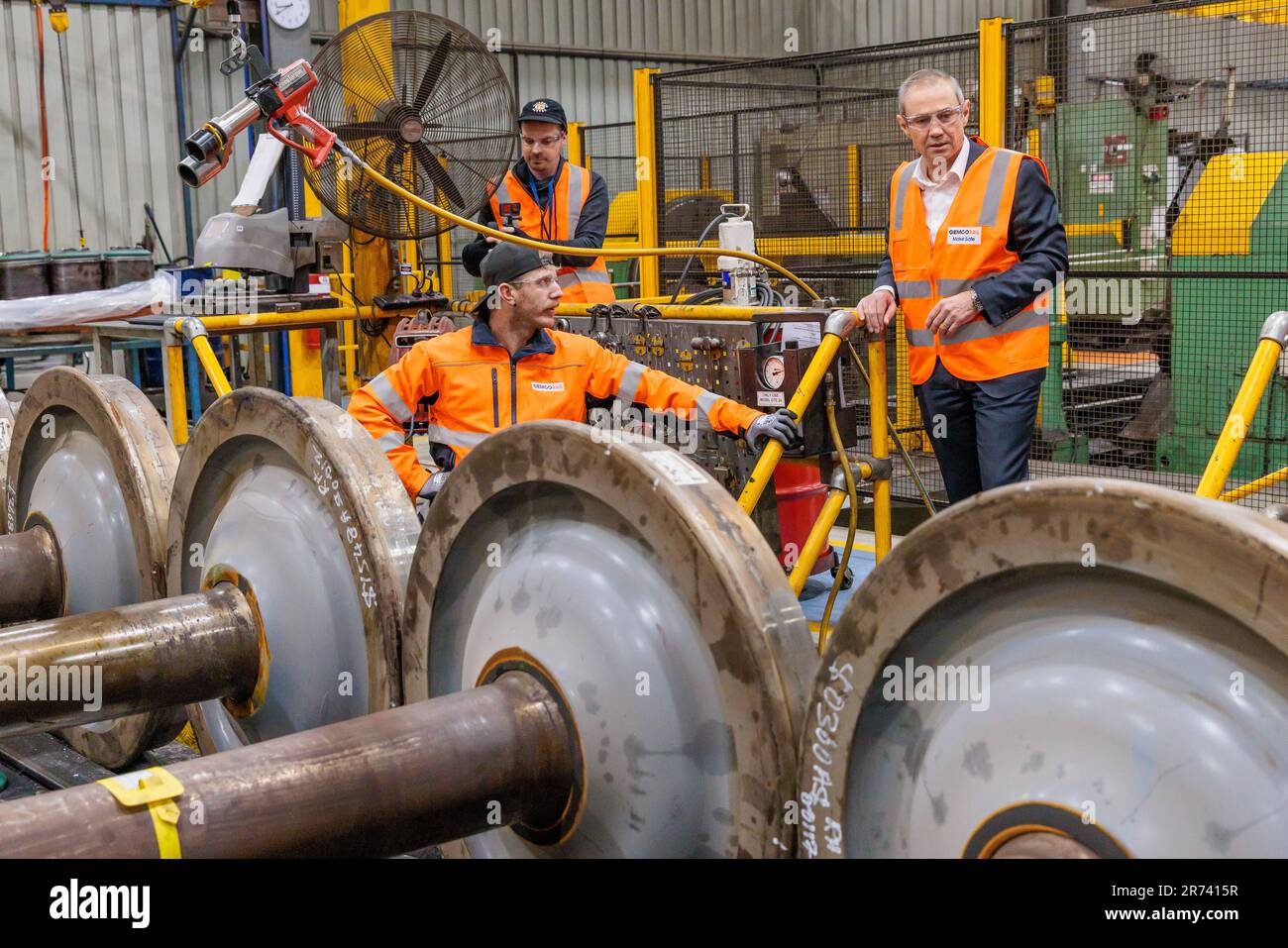 Western Australian Premier Roger Cook talks with workers during a visit ...