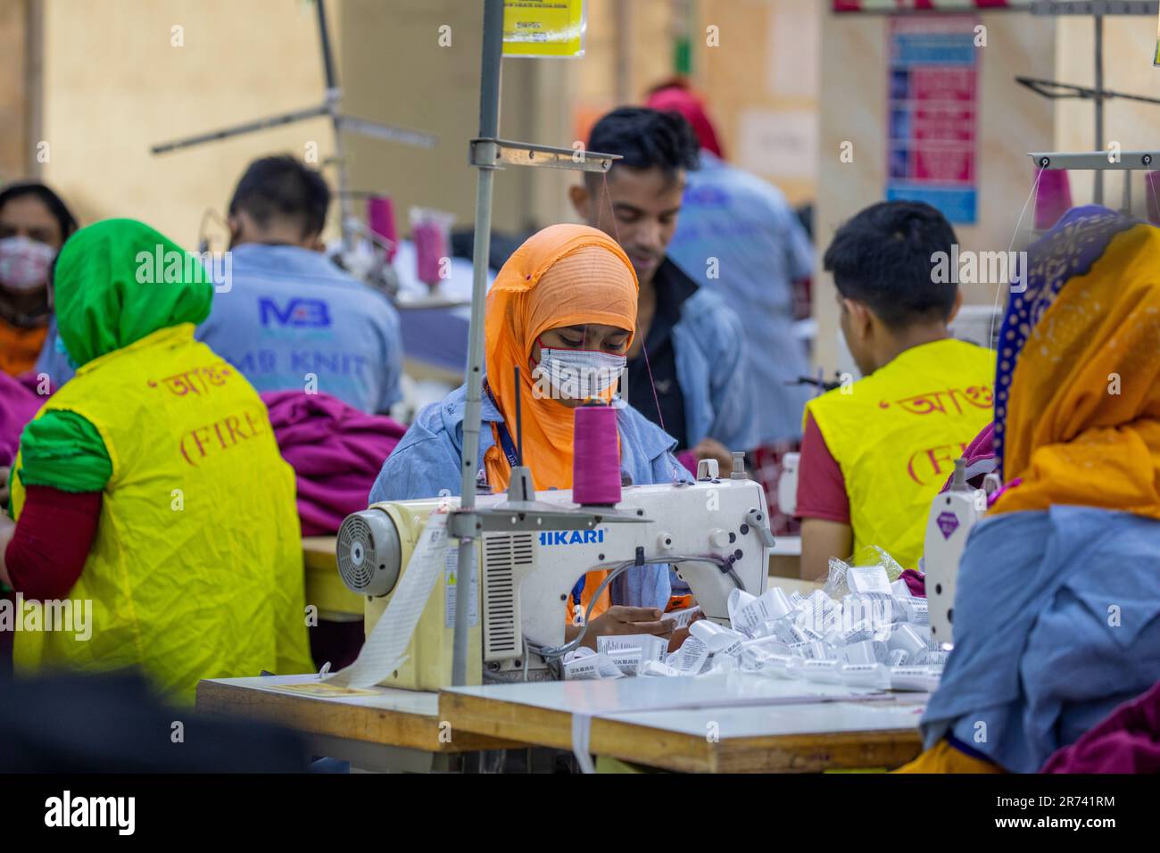 Ready-made garments (RMG) workers working in a factory at Fatullah in ...