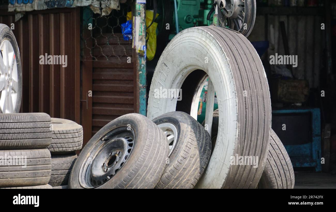 Pile of car tires in the garage Stock Photo - Alamy