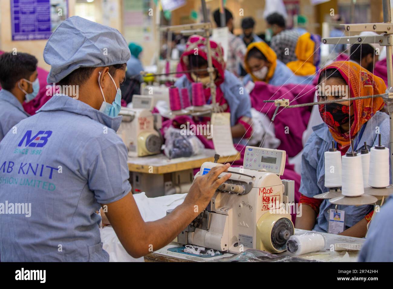 Ready-made garments (RMG) workers working in a factory at Fatullah in ...
