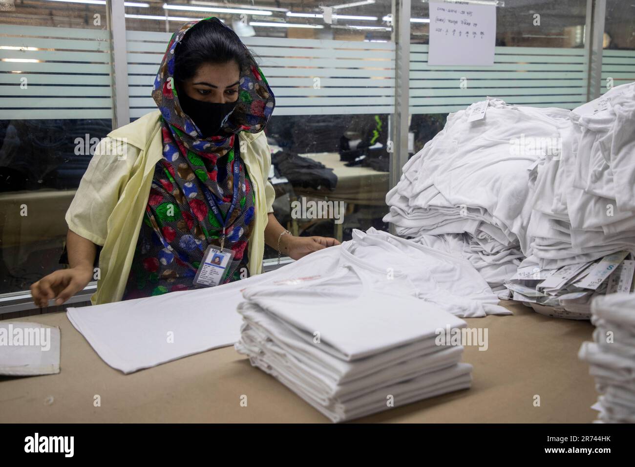 Ready-made garments (RMG) workers working in a factory at Fatullah in ...