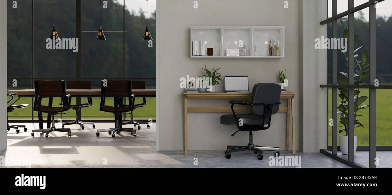 A workstation with a laptop mockup and a formal meeting table in a ...