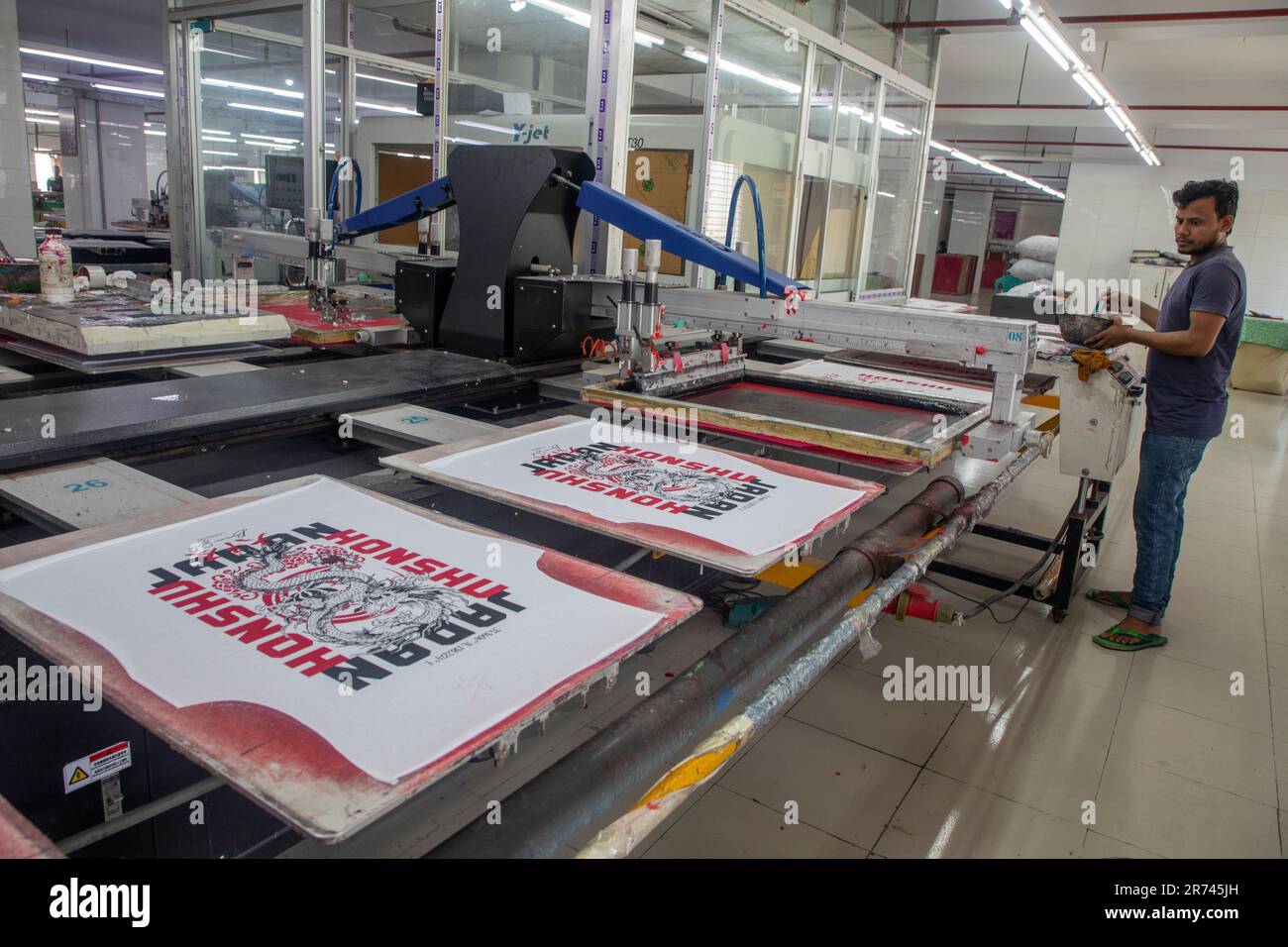 Modern printing machine with t-shirt at workplace at Fatullah in Narayanganj, Bangladesh Stock ...