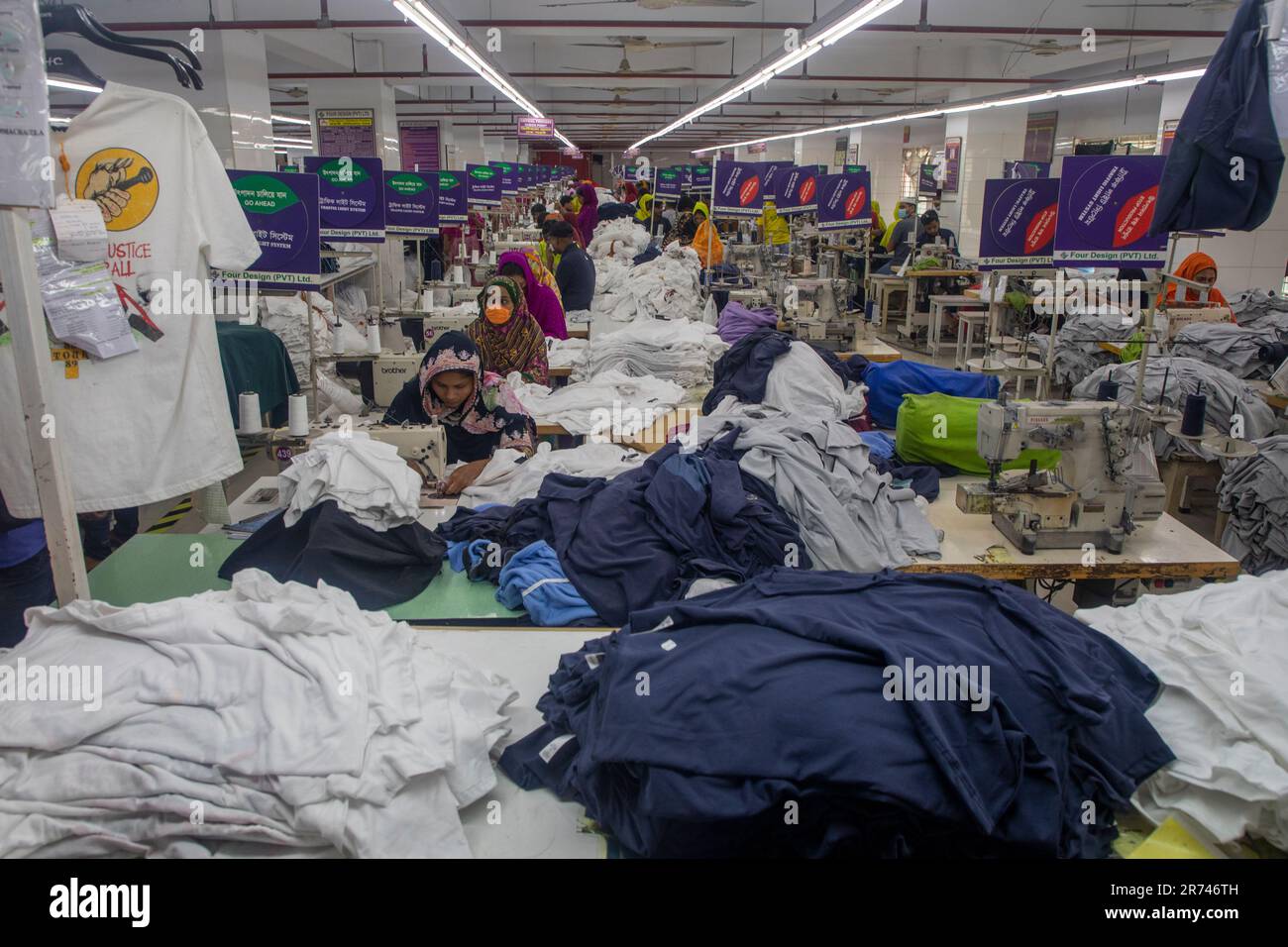 Ready-made garments (RMG) workers working in a factory at Fatullah in ...