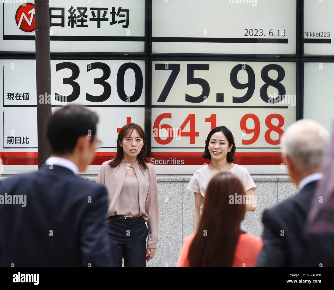 An electric monitor shows the 225-issue Nikkei stock average climbing in Chuo Ward, Tokyo on ...
