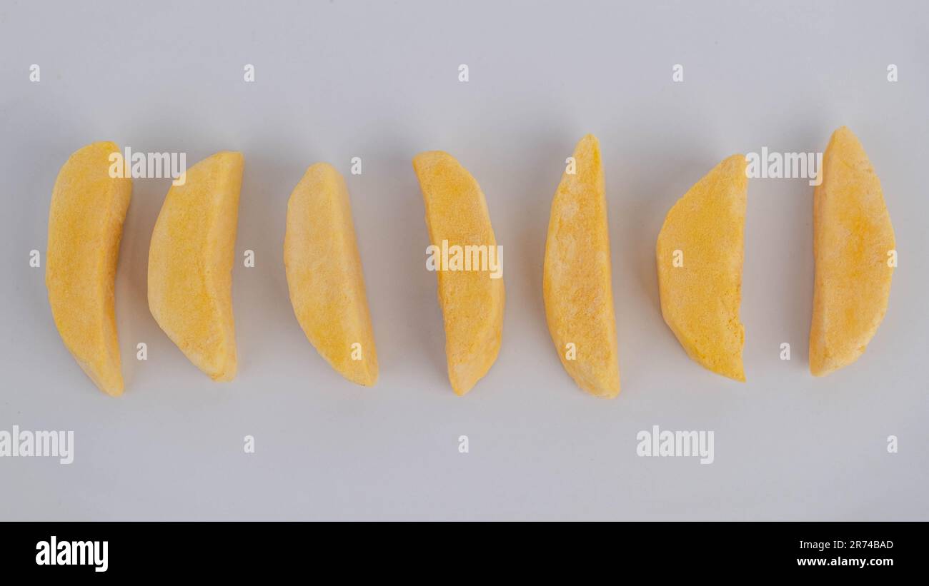 Healthy freeze dried fruits. Pieces of mango with freeze dry process ...