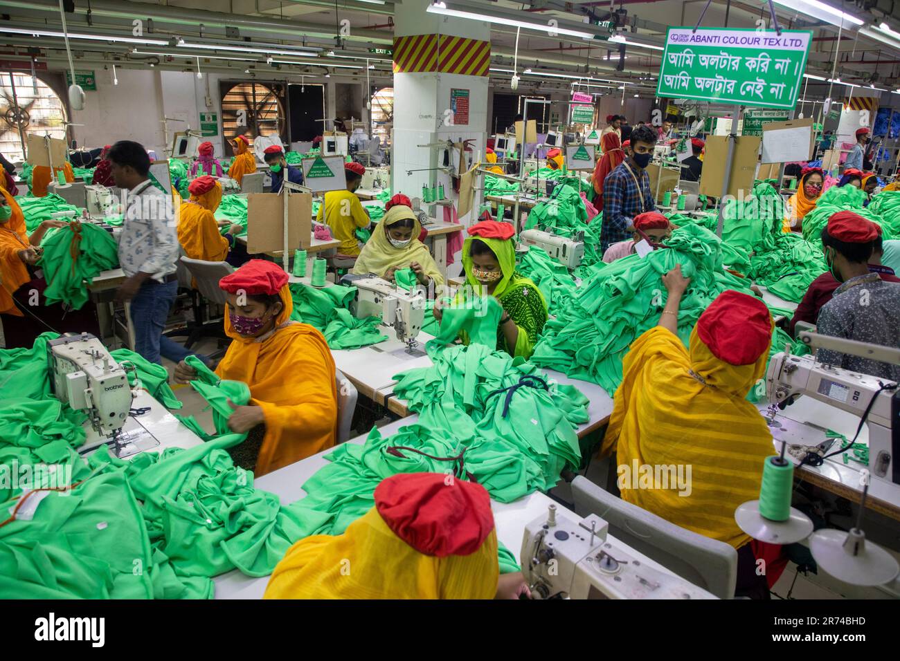 Ready-made garments (RMG) workers working in a factory at Fatullah in ...
