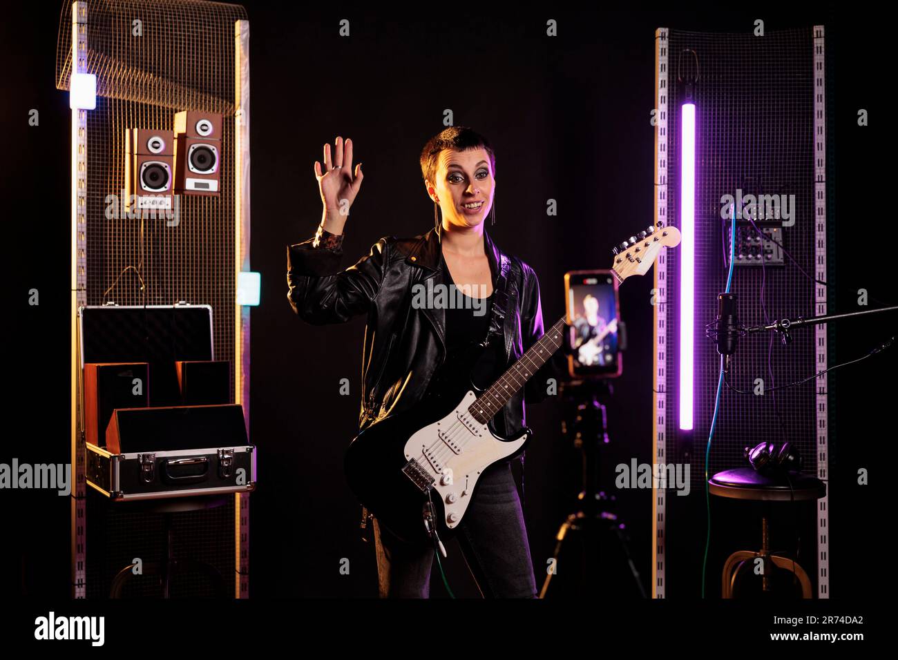 Rebel rockstar playing at electric guitar recording new heavy metal ...