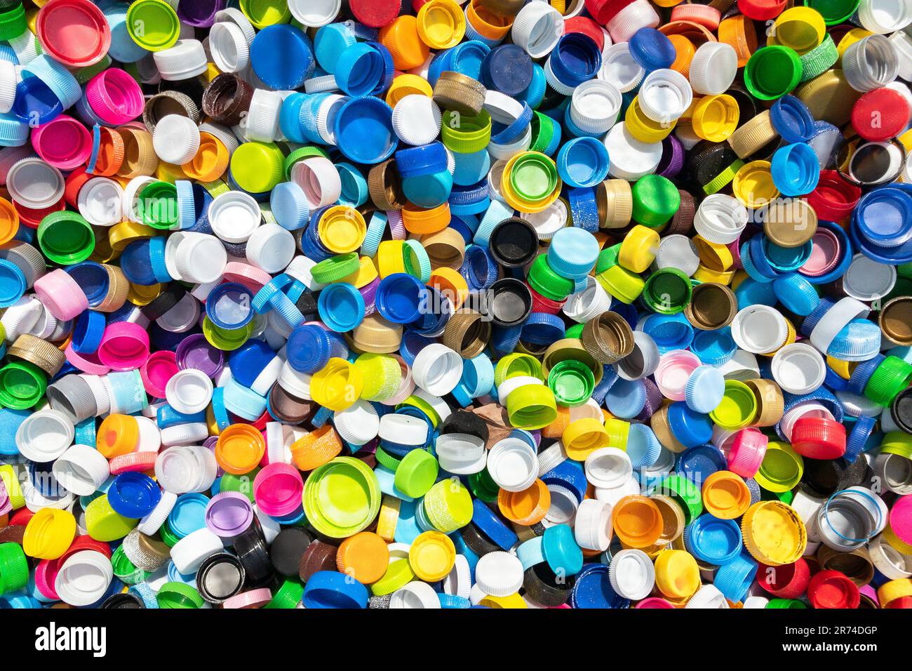 Colorful plastic caps lay on the floor Stock Photo - Alamy