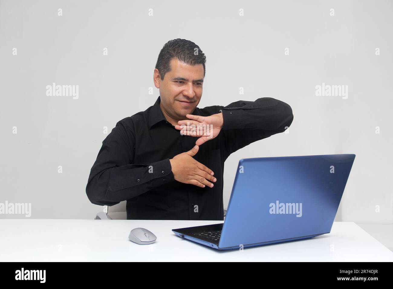 Latino adult man speaks Mexican sign language with a deaf person ...