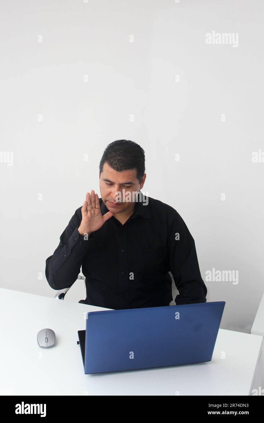 Latino adult man speaks Mexican sign language with a deaf person ...