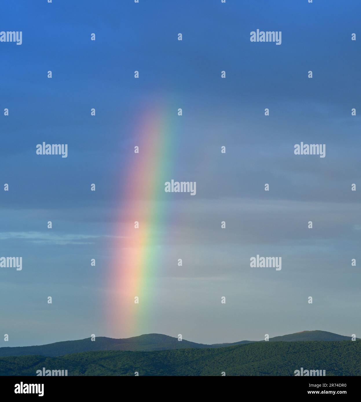 Natural colorful rainbow in clouds Stock Photo - Alamy