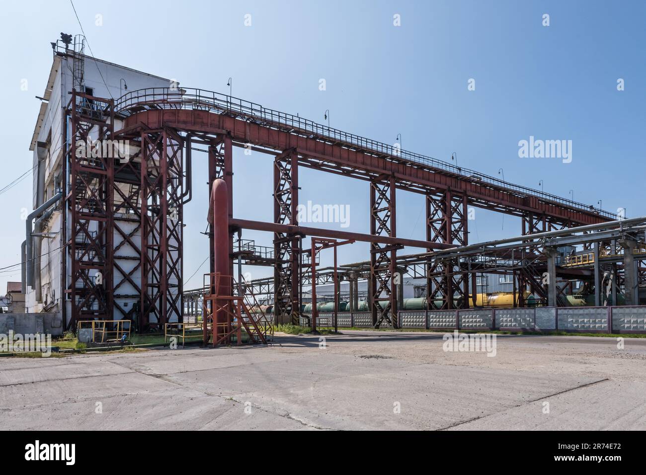 old rusty pipes, ladders and frames and metal inside an industrial ...