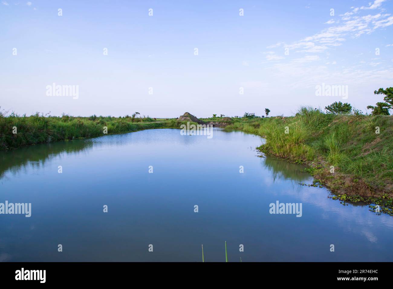 Lake water with green grass landscape view of under the blue sky Stock ...