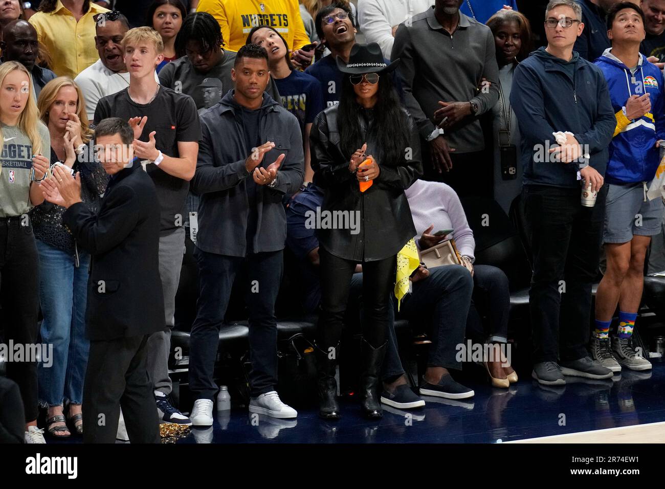 Denver Broncos' Russell Wilson, center left, and his wife Ciara, right ...