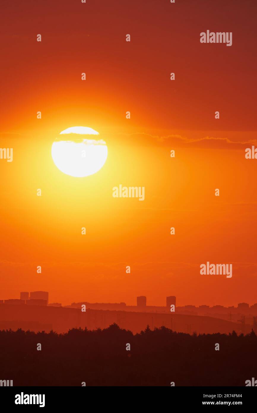 The hot sun beat down on us as we watched the sunset from the city ...