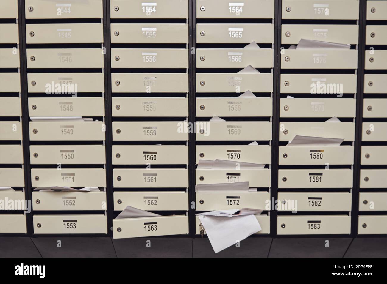 Mail boxes with overflowing documents and bills. Mailboxes with letters ...