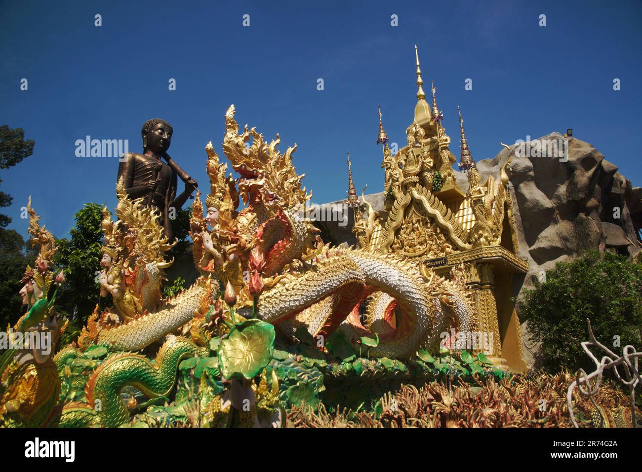 Outdoor Buddha standing statue at the entrance to the tunnel, the way ...