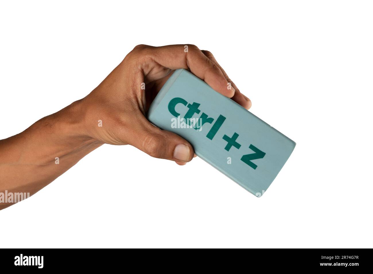 black male Hand holding an eraser with inscription ctrl z on white background Stock Photo - Alamy