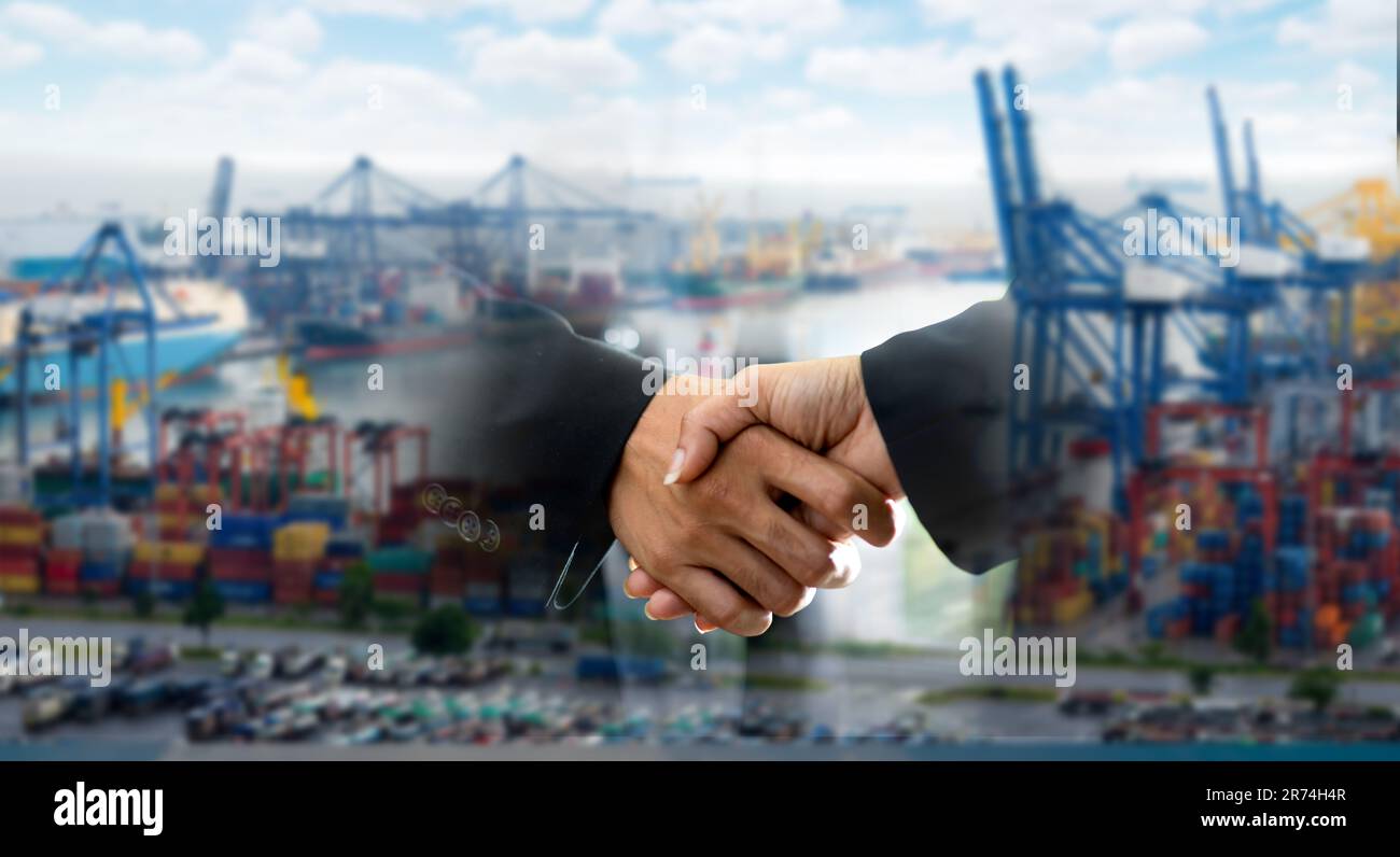 Container Cargo freight ship with working crane bridge in shipyard at ...