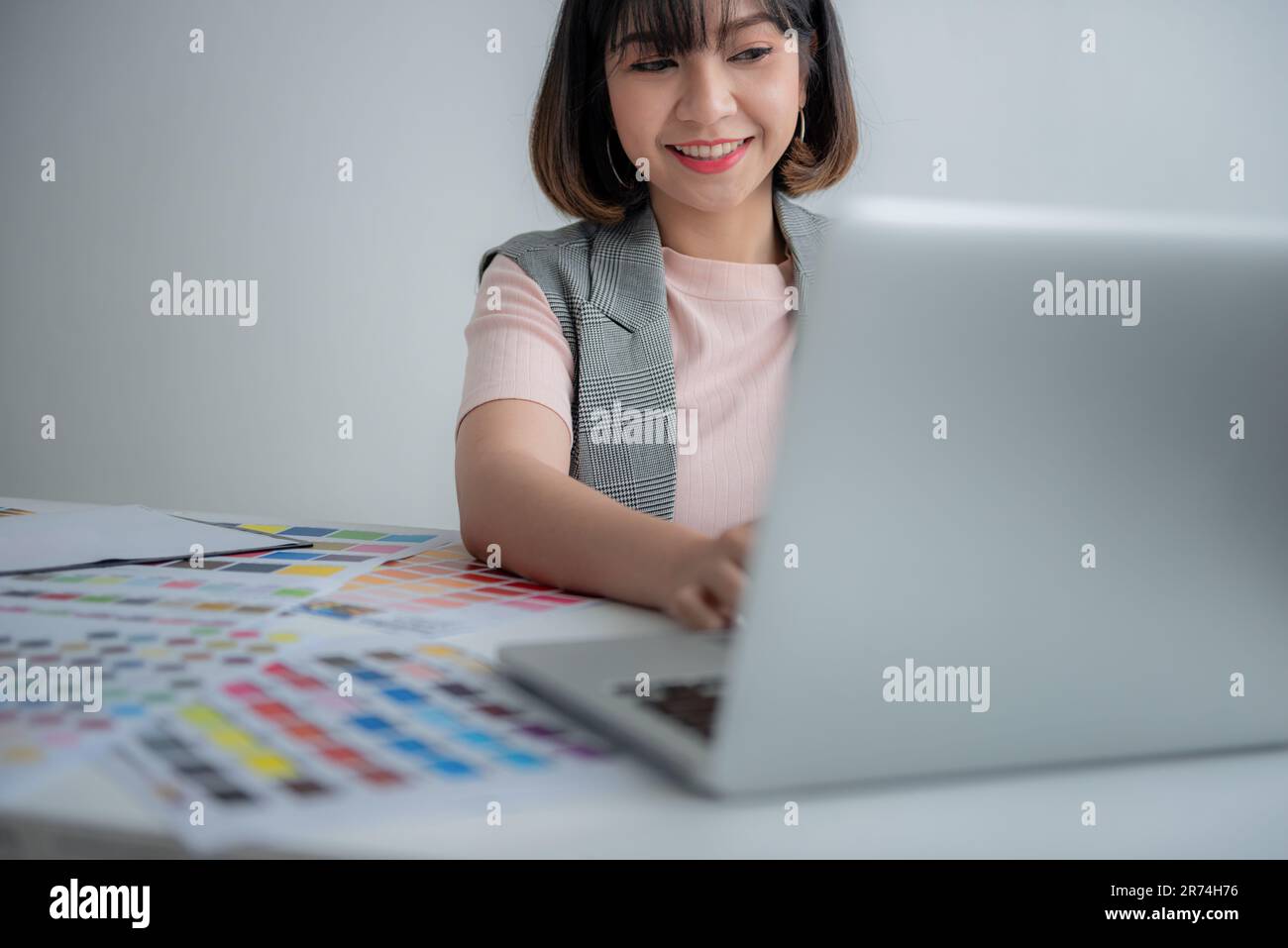 Designer using laptop to design fashion clothes. Fashion Design Concept ...