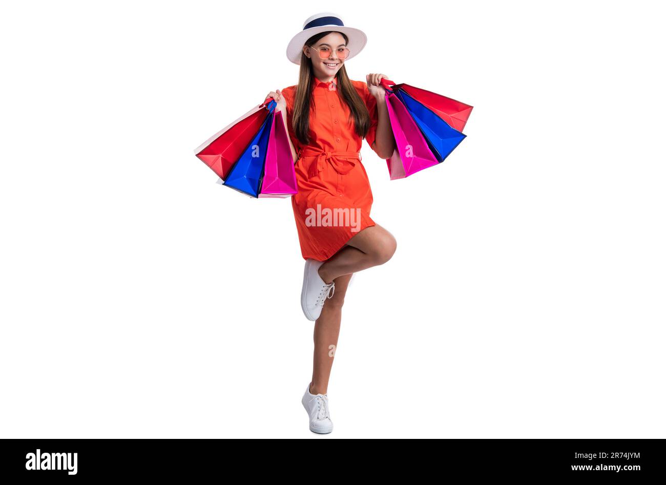 happy teen shopper girl in studio. teen shopper girl on background ...