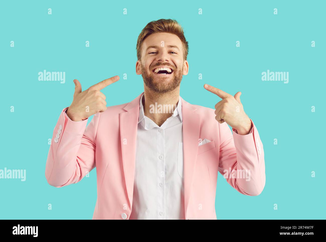 Young handsome man pointing at himself with index finger smiling ...