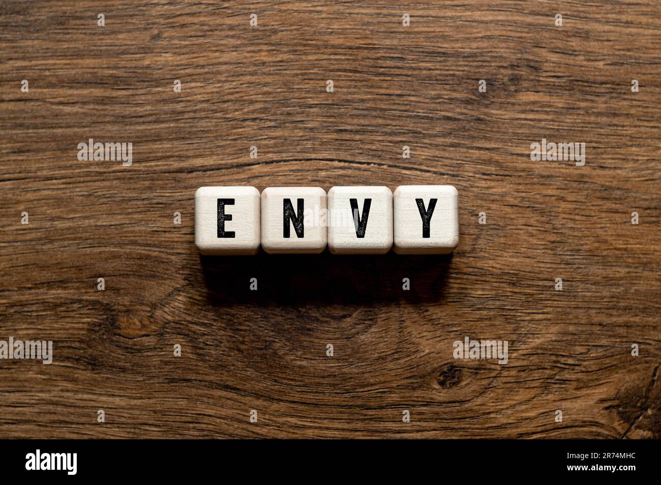 Envy - word concept on building blocks, text, letters Stock Photo - Alamy