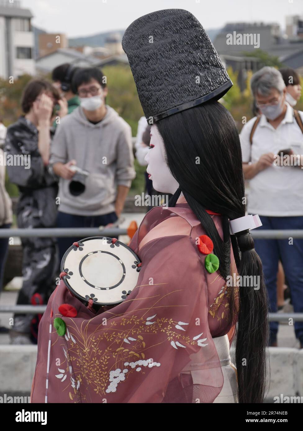 A woman dresserd in historic costume for Jidai Matsuri in Kyoto ...
