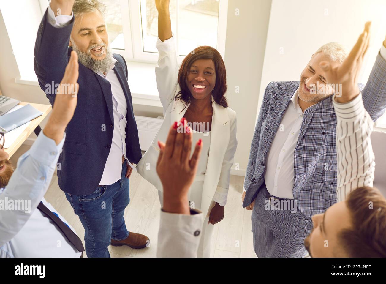 Woman raise hands in the meeting hi-res stock photography and images ...