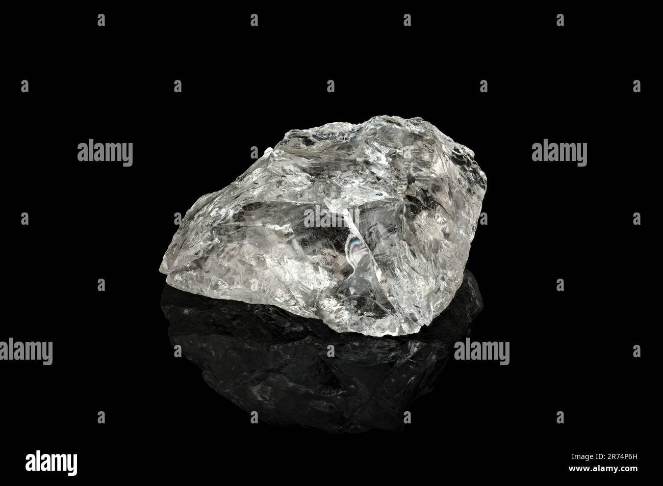 clear quartz isolated on black background. macro detail close-up rough ...