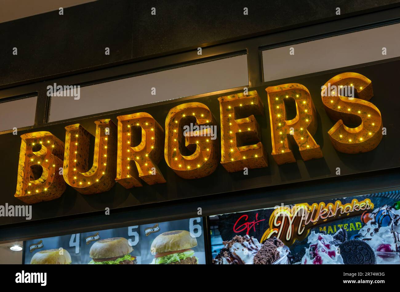 Burgers sign at Flavortown cafe restaurant bar, departure lounge area ...