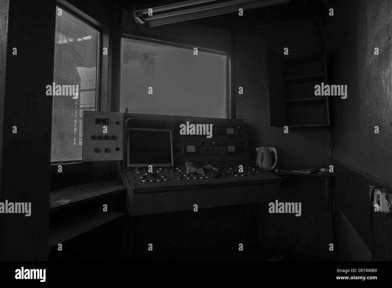 A vintage computer set in an abandoned industrial building in Poland in ...