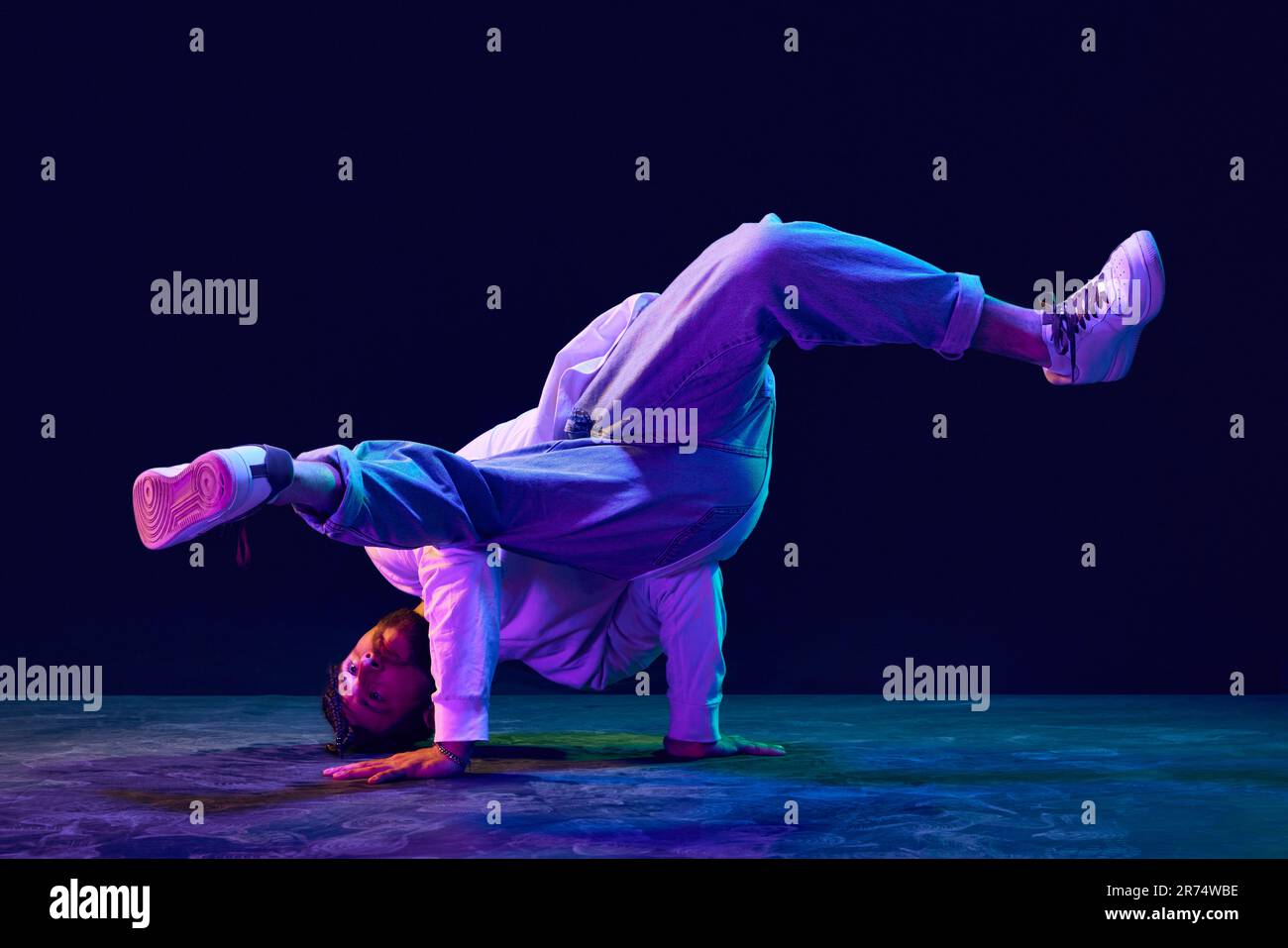 Dynamic image of active young man in sport style clothes dancing ...