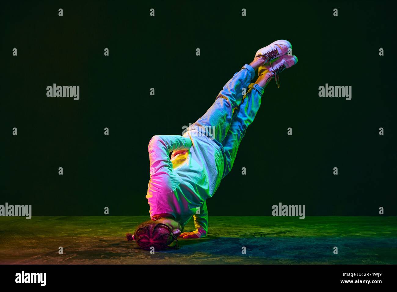 Young guy with dreads, in sport style clothes dancing breakdance, hip ...