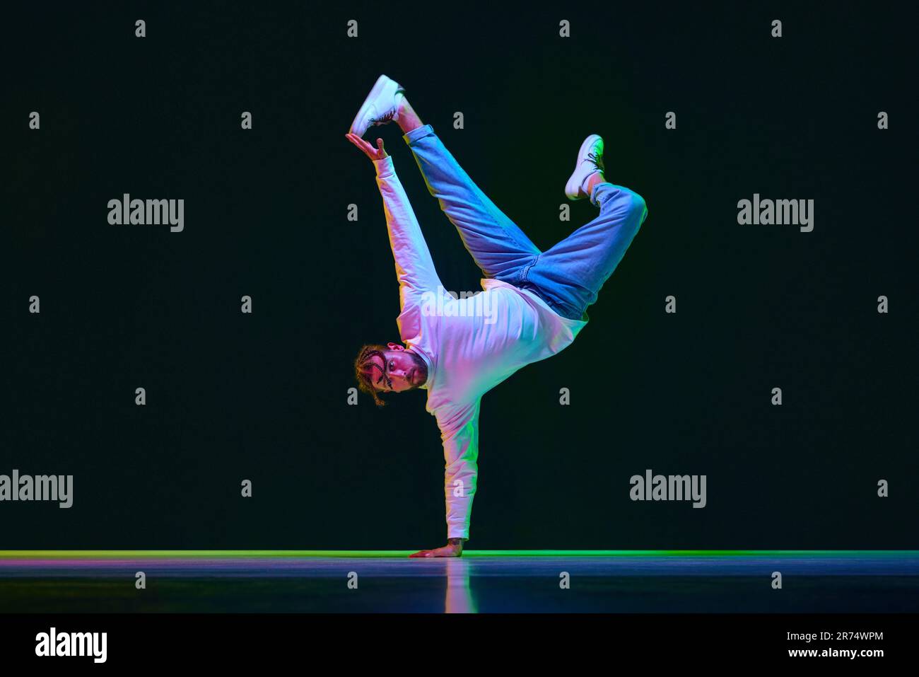 Dynamic image of talented, active young man in sport style clothes ...