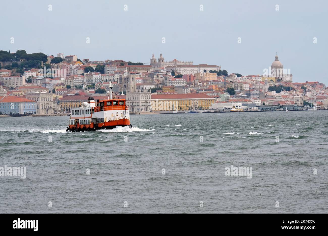 Old ferry crossing the water in Lisbon, Portugal Stock Photo - Alamy