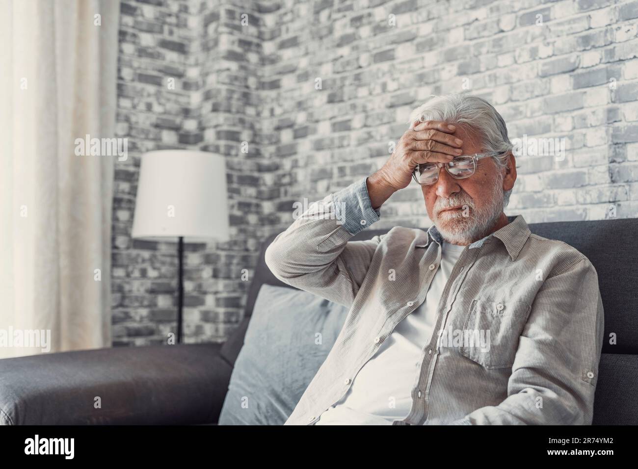 Frustrated unhealthy senior mature man touching head, having painful ...