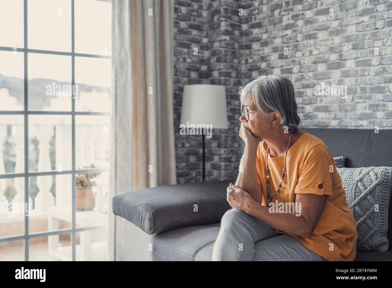 Face Of Senior Caucasian Hoary Woman Looking Away Deep In Sad Thoughts