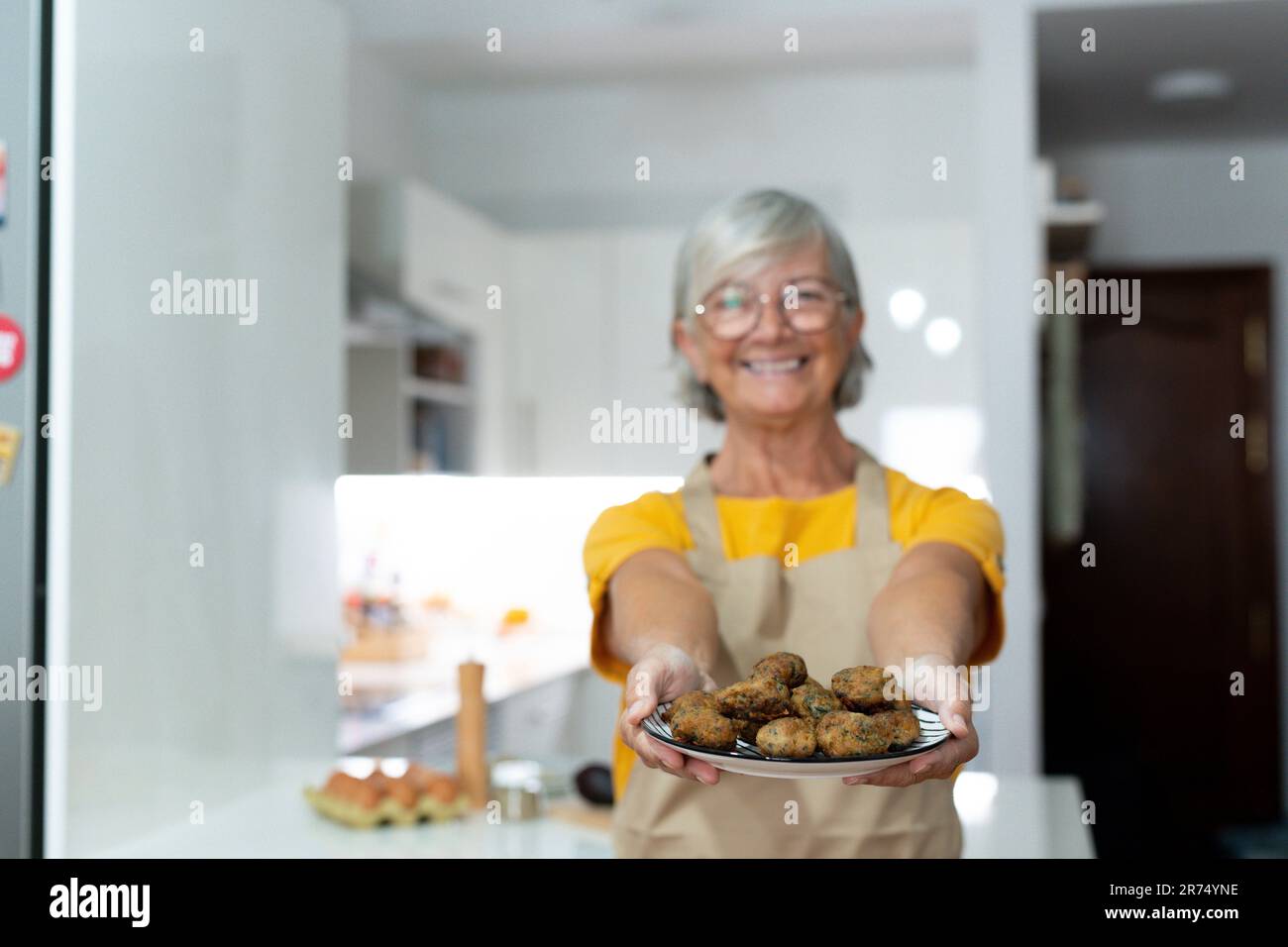 Smiling cook holding meat hi-res stock photography and images - Alamy