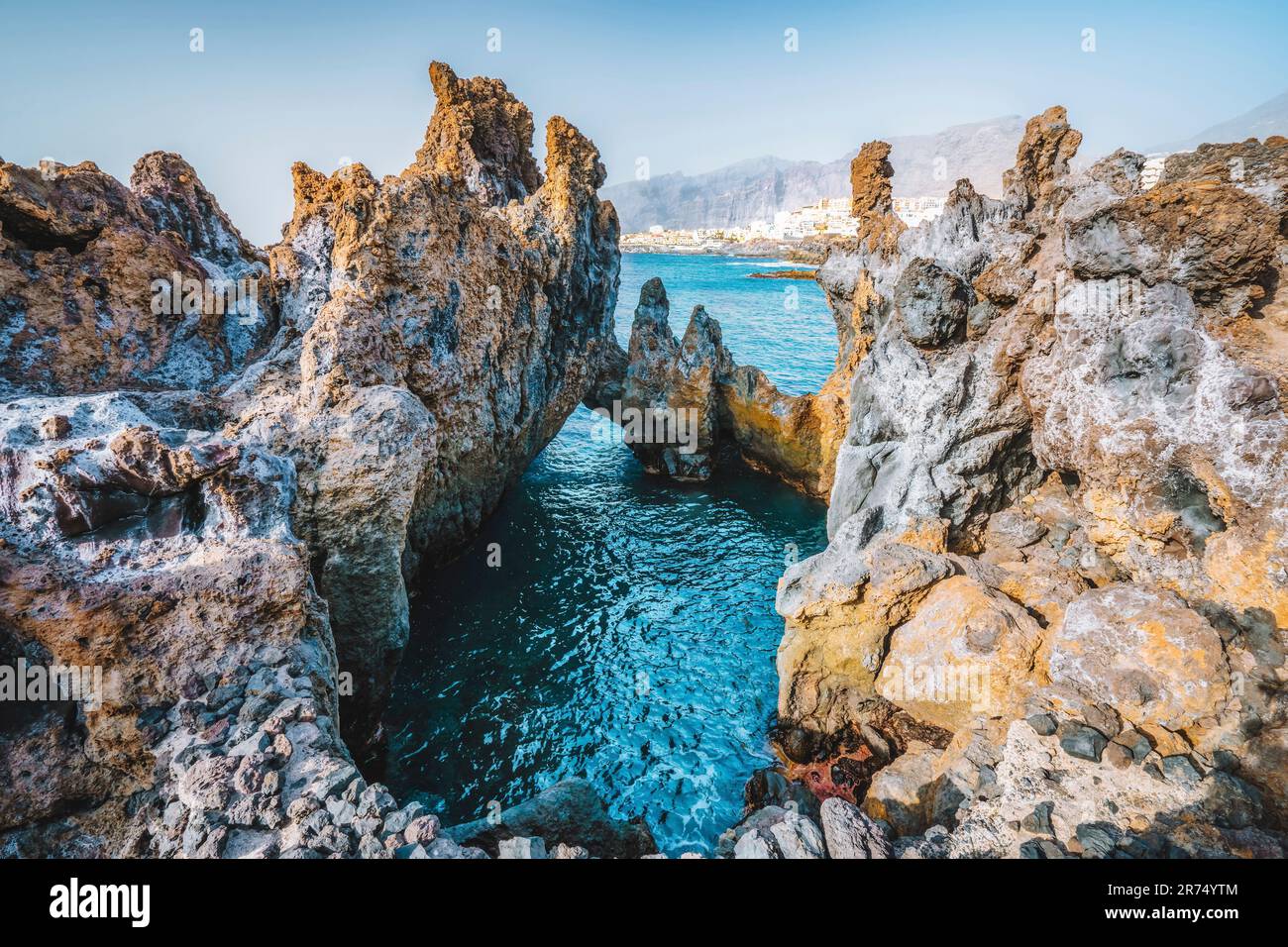 Natural swimming pool. Charco el Diablo, bizarre lava volcanic rock ...