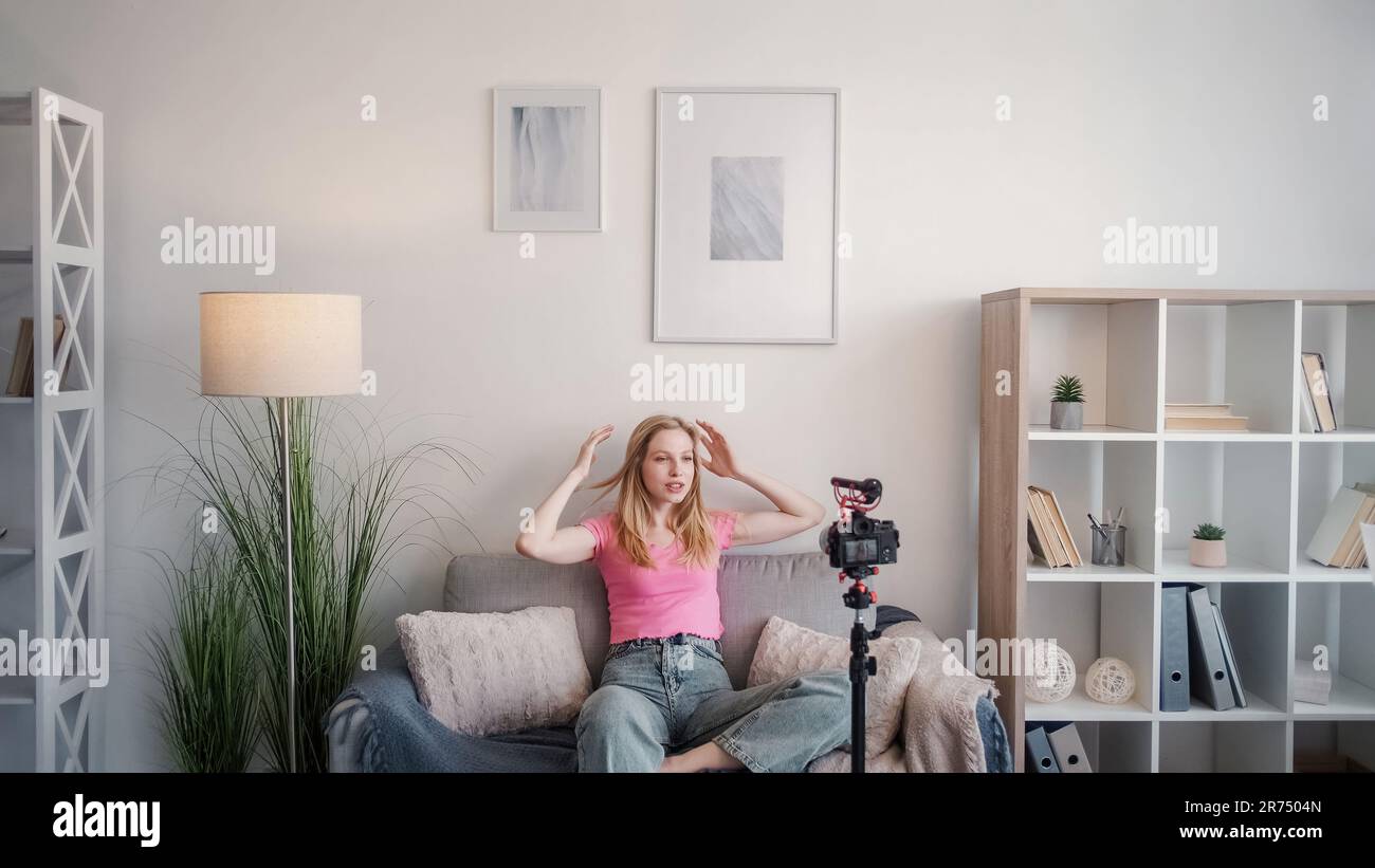 Vlog content video tutorial woman camera home Stock Photo - Alamy