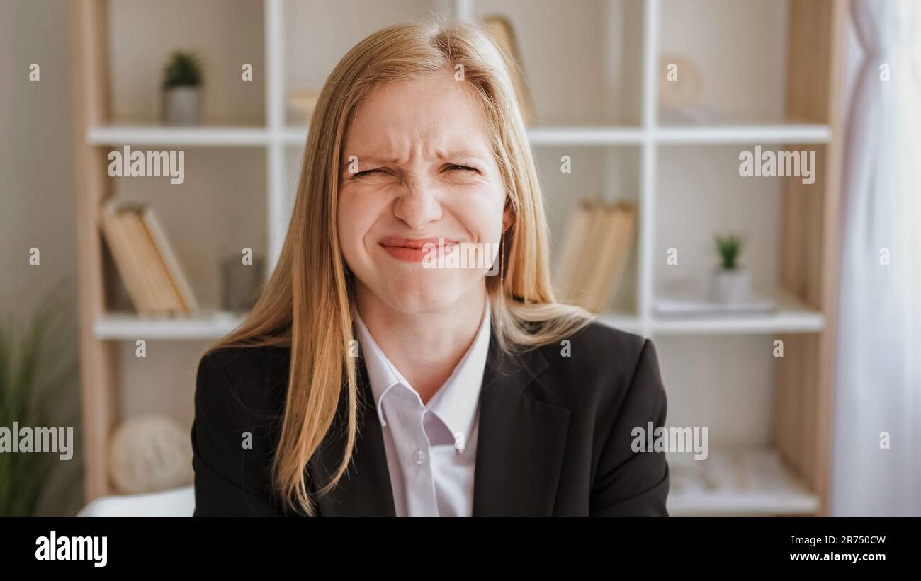 Embarrassed expression mistake fail woman wincing Stock Photo - Alamy