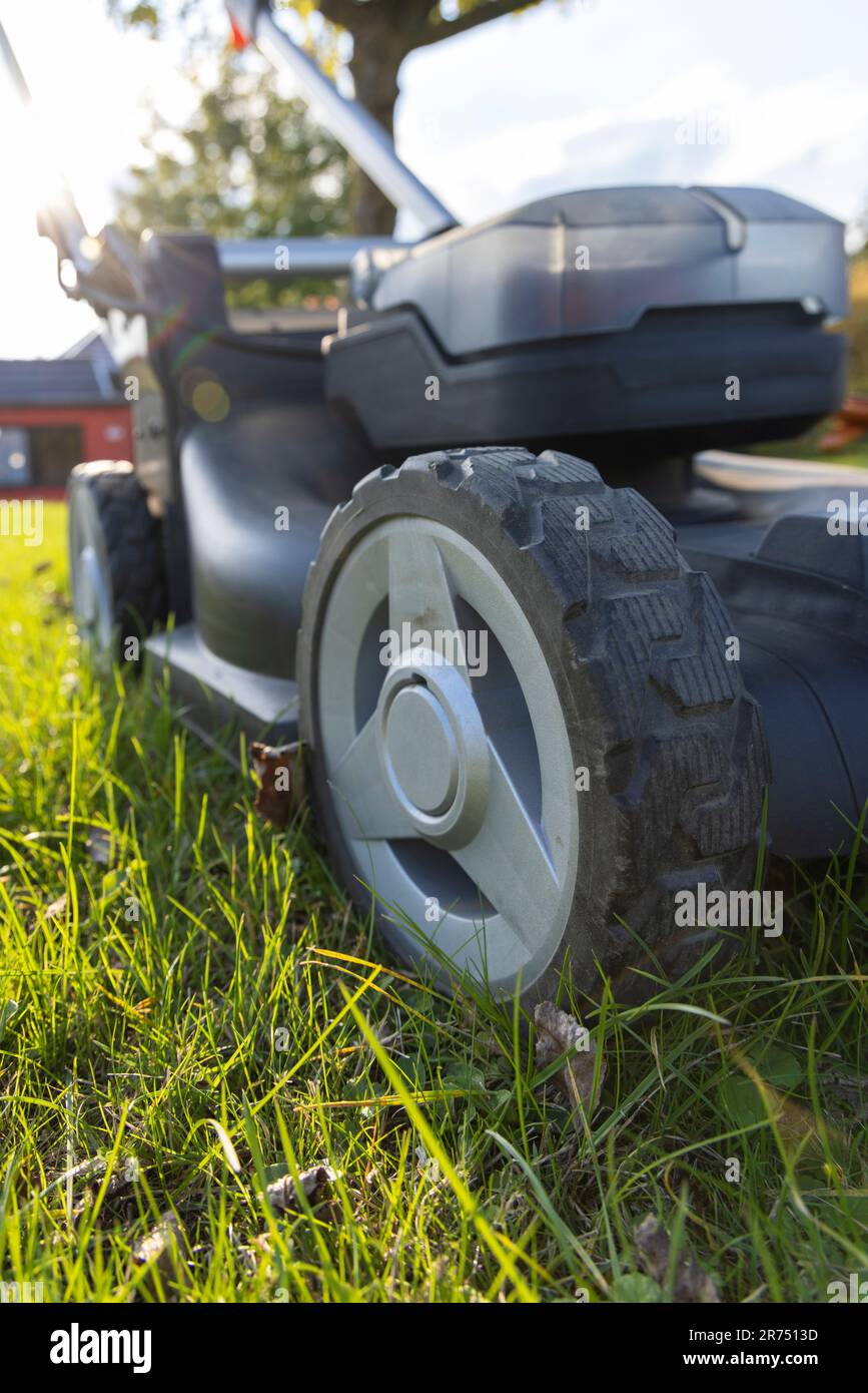 Lawn mower wheel front, detail, cordless lawn mower lawn mowing, garden ...